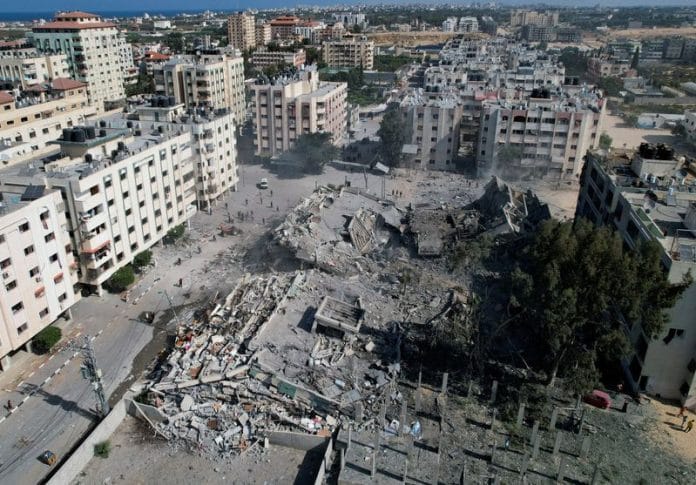 Israel pummels Gaza district, evacuates town as invasion looms ...