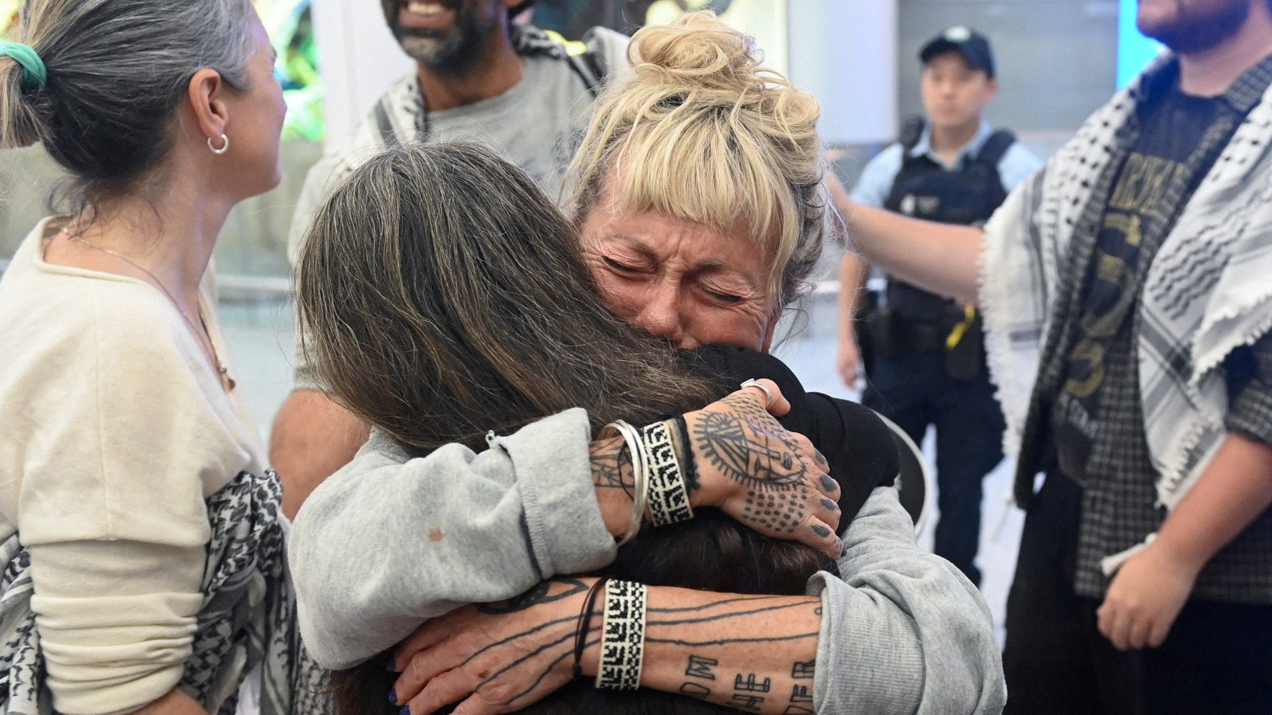 Australian activists return home, allege 'abuse, sexual assault and ...