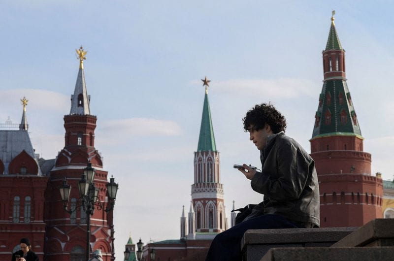 Two phones and an app: How Russians skirt Putin's digital iron curtain ...
